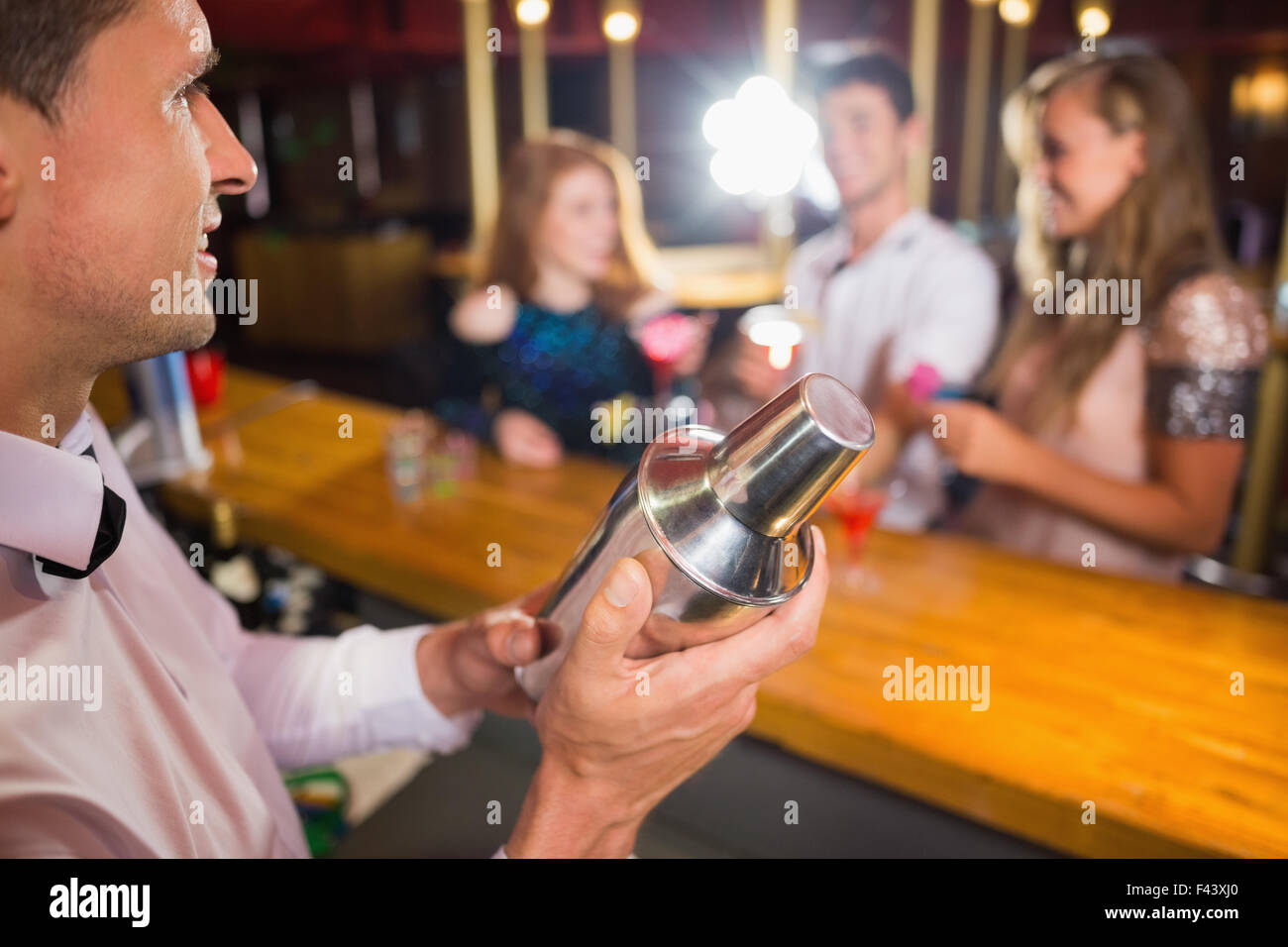 Bartender mixing up a cocktail Stock Photo - Alamy