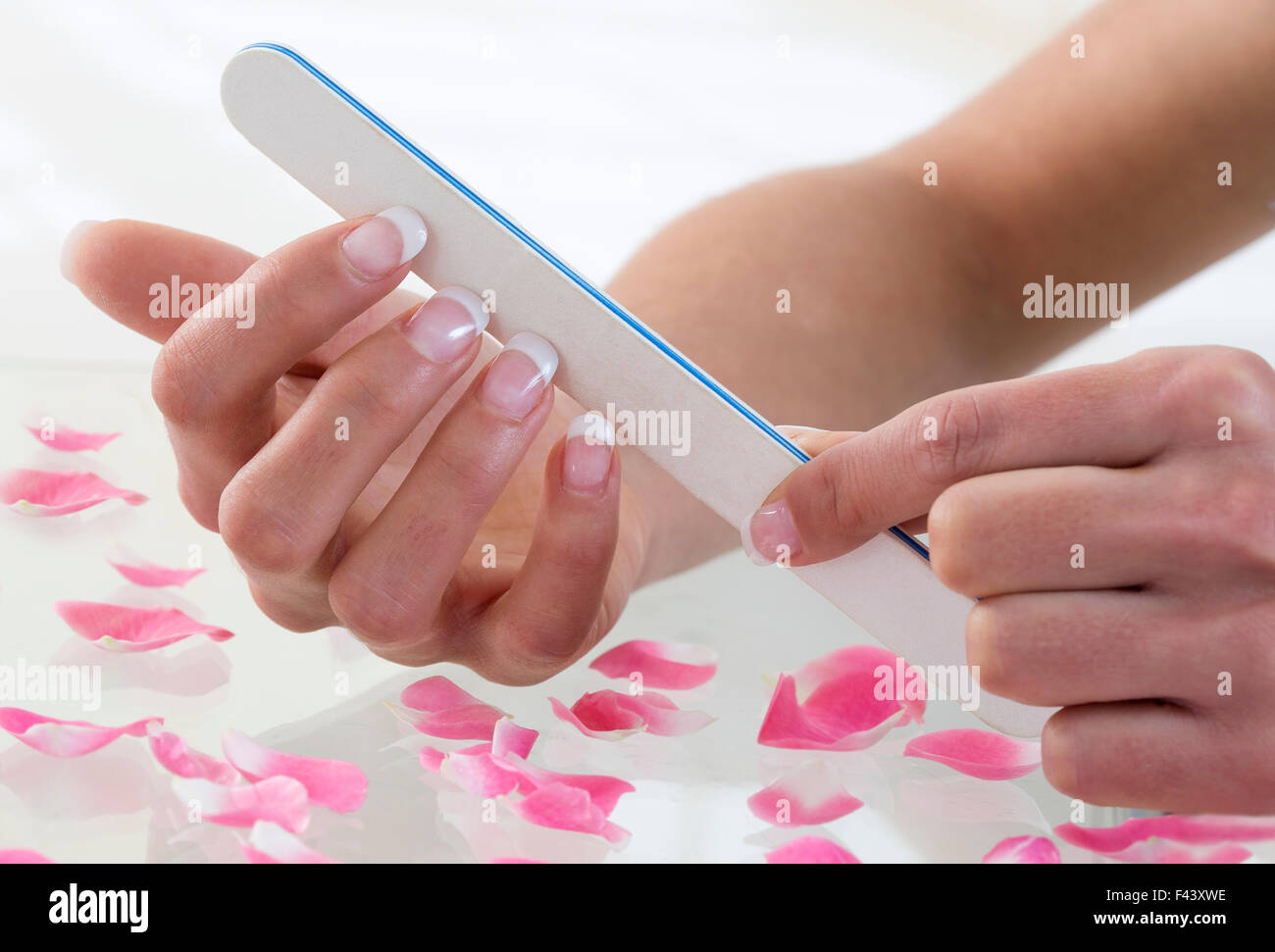 Hands of young woman with manicure Stock Photo - Alamy