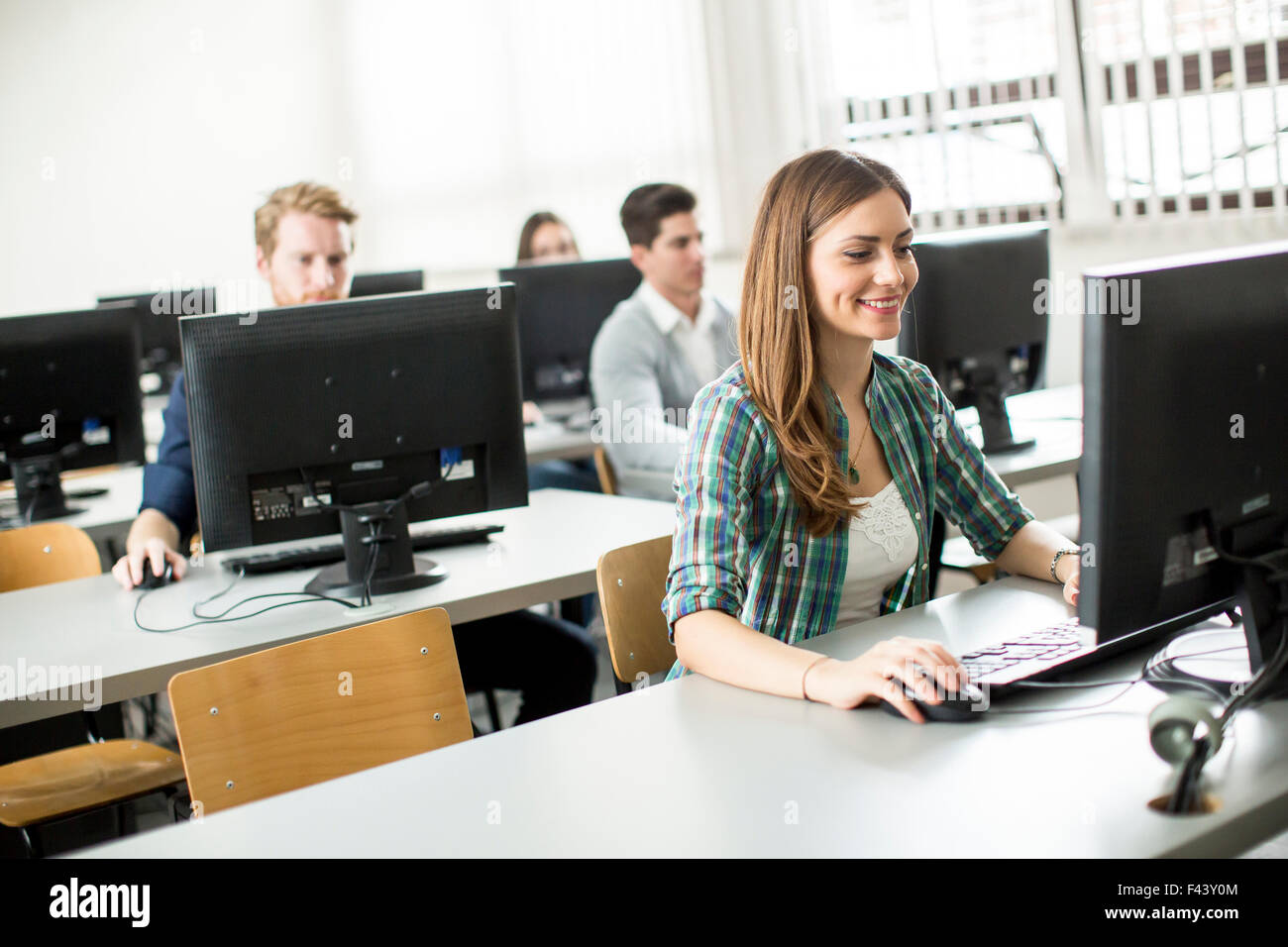Young people in the classroom Stock Photo - Alamy