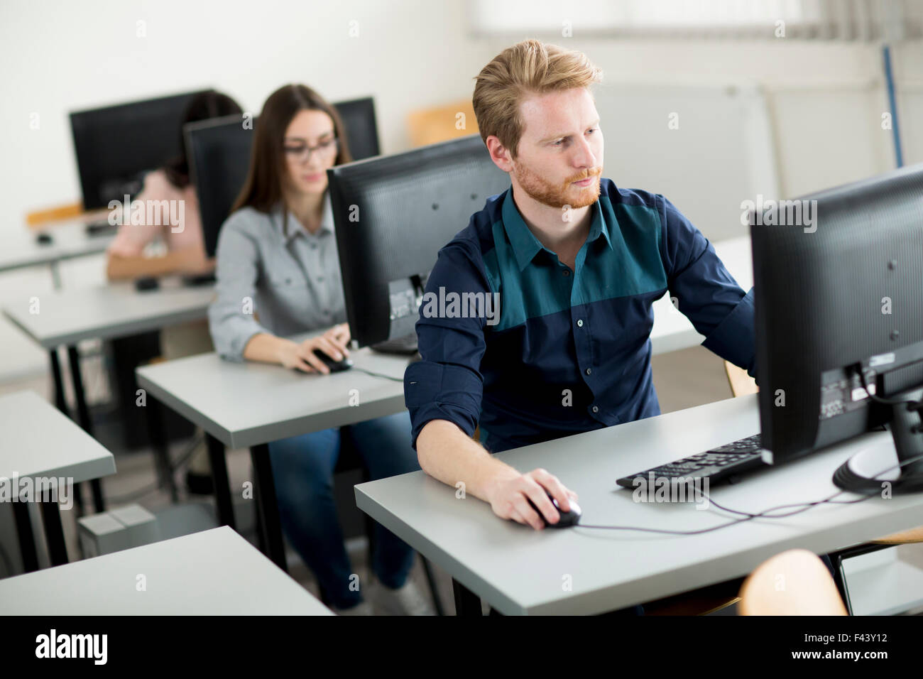 Young people in the classroom Stock Photo - Alamy