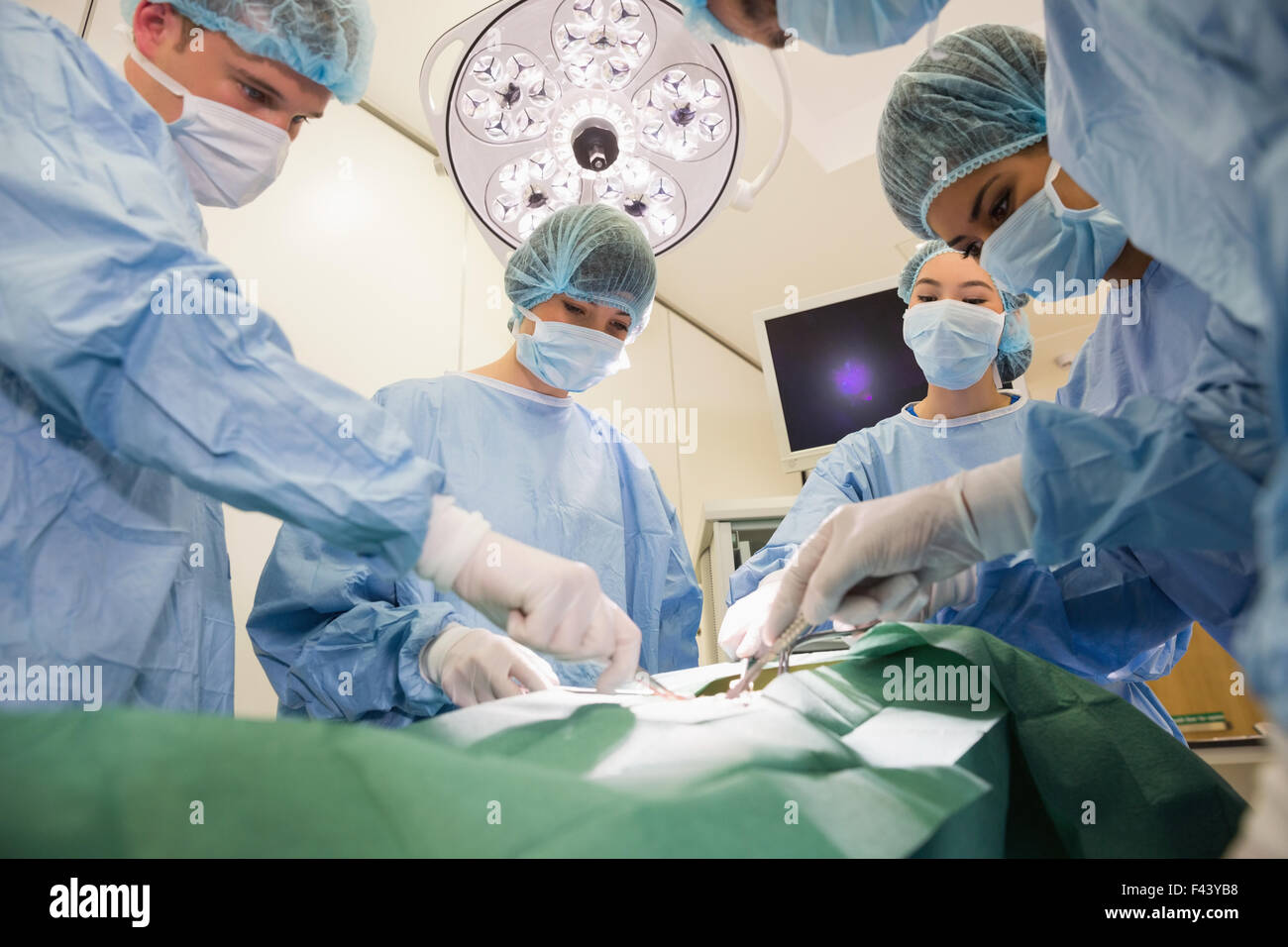 Medical students practicing surgery on model Stock Photo - Alamy