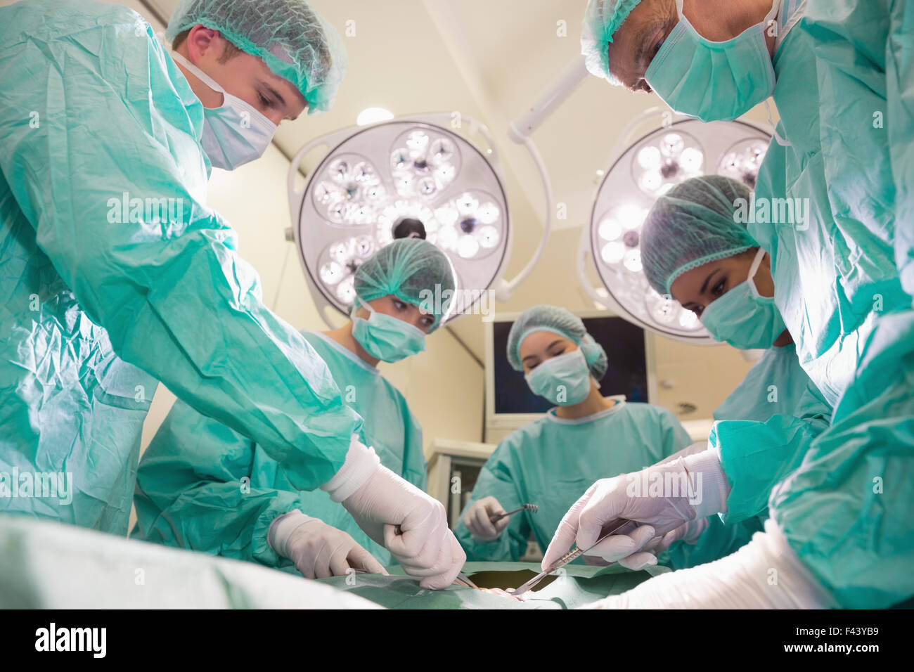 Medical students practicing surgery on model Stock Photo - Alamy