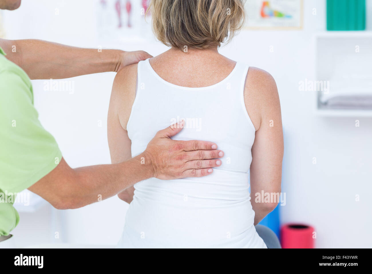 Doctor examining his patient back Stock Photo - Alamy