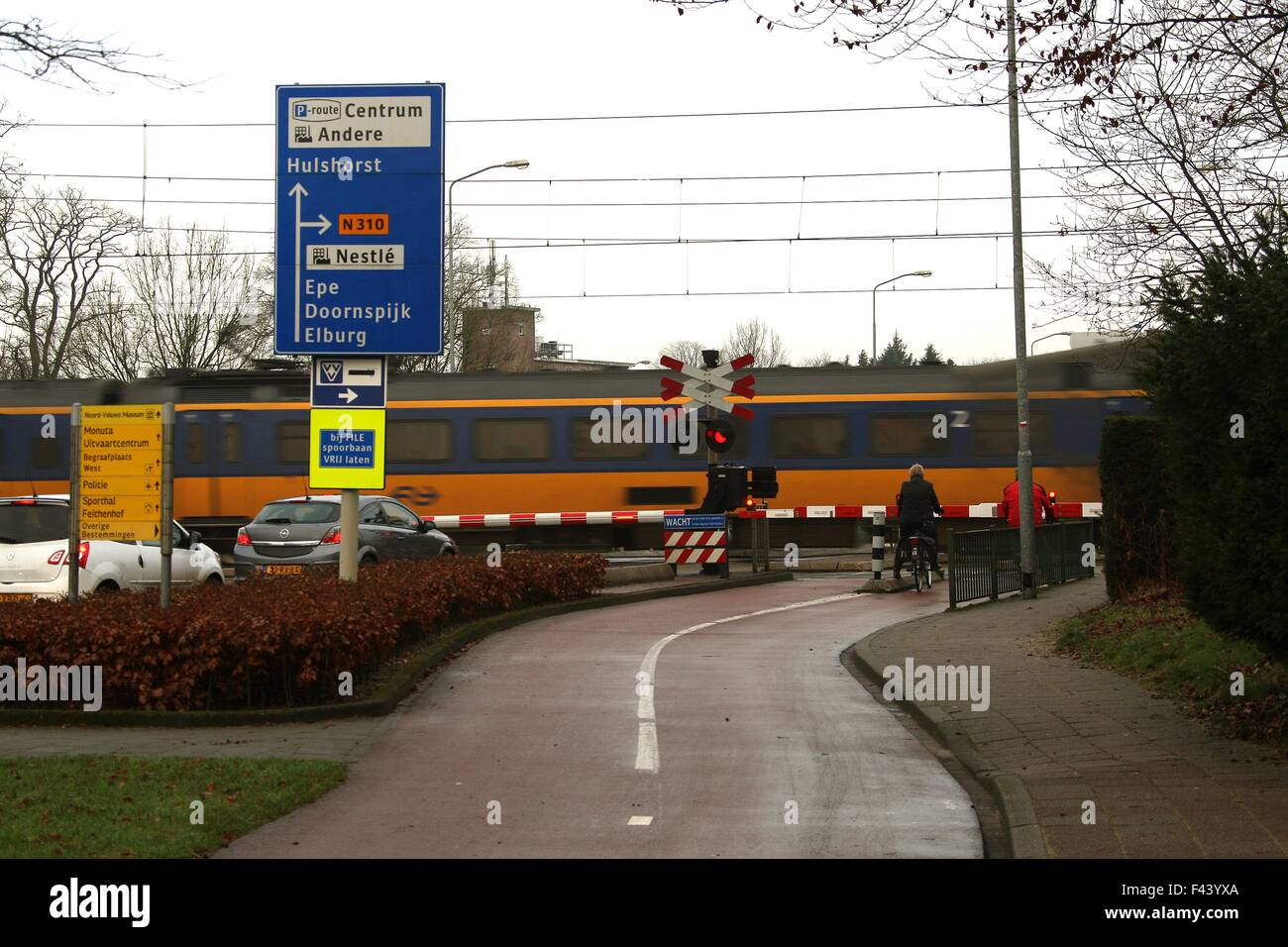 Safety warning signs at the railway train station road traffic crossing ...
