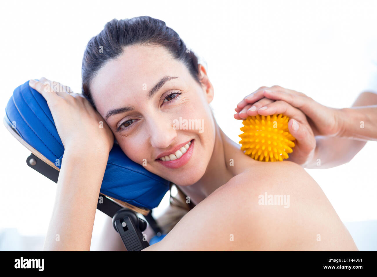 Woman having back massage with massage ball Stock Photo - Alamy