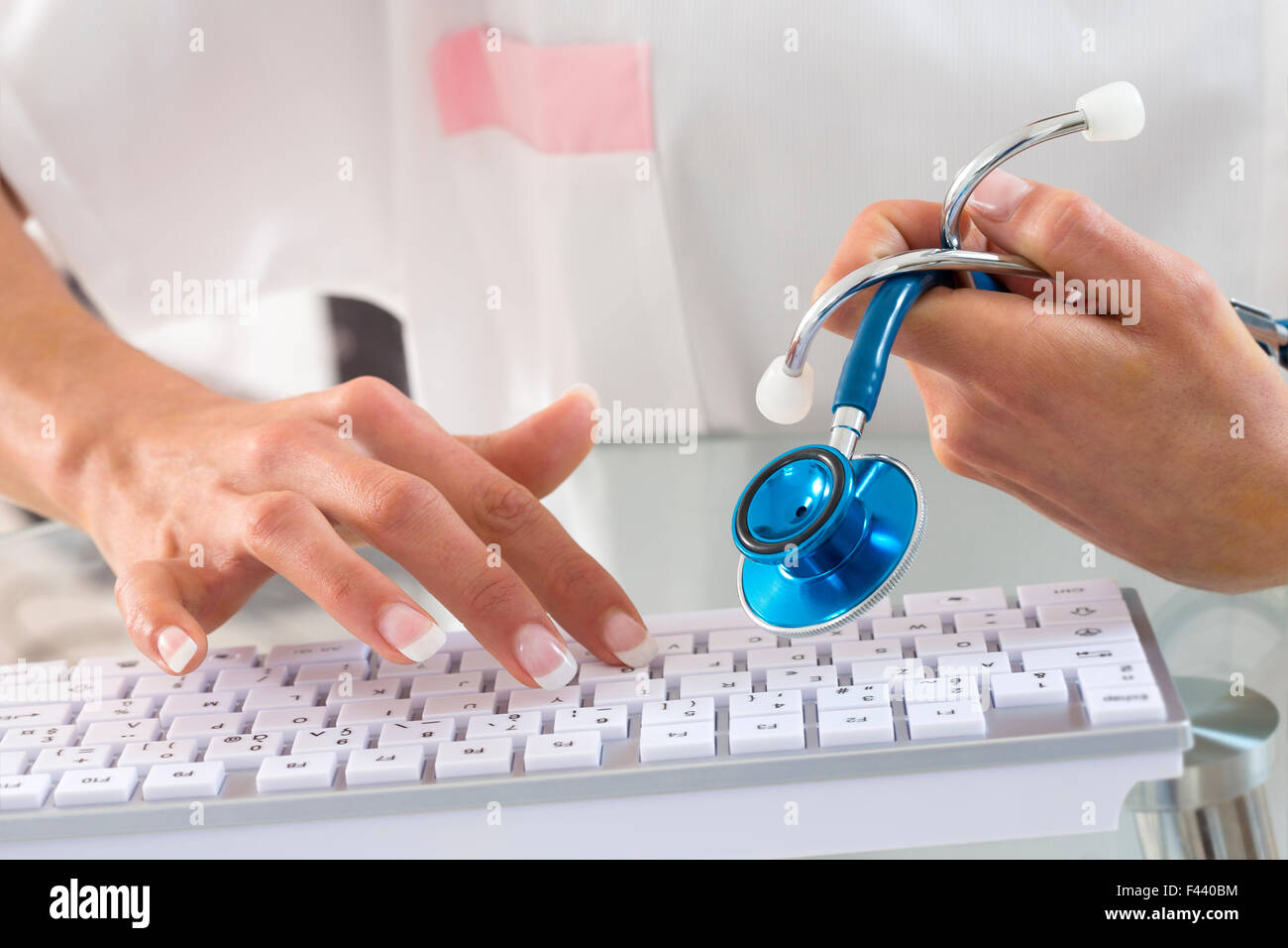 Female doctor typing computer hi-res stock photography and images - Alamy