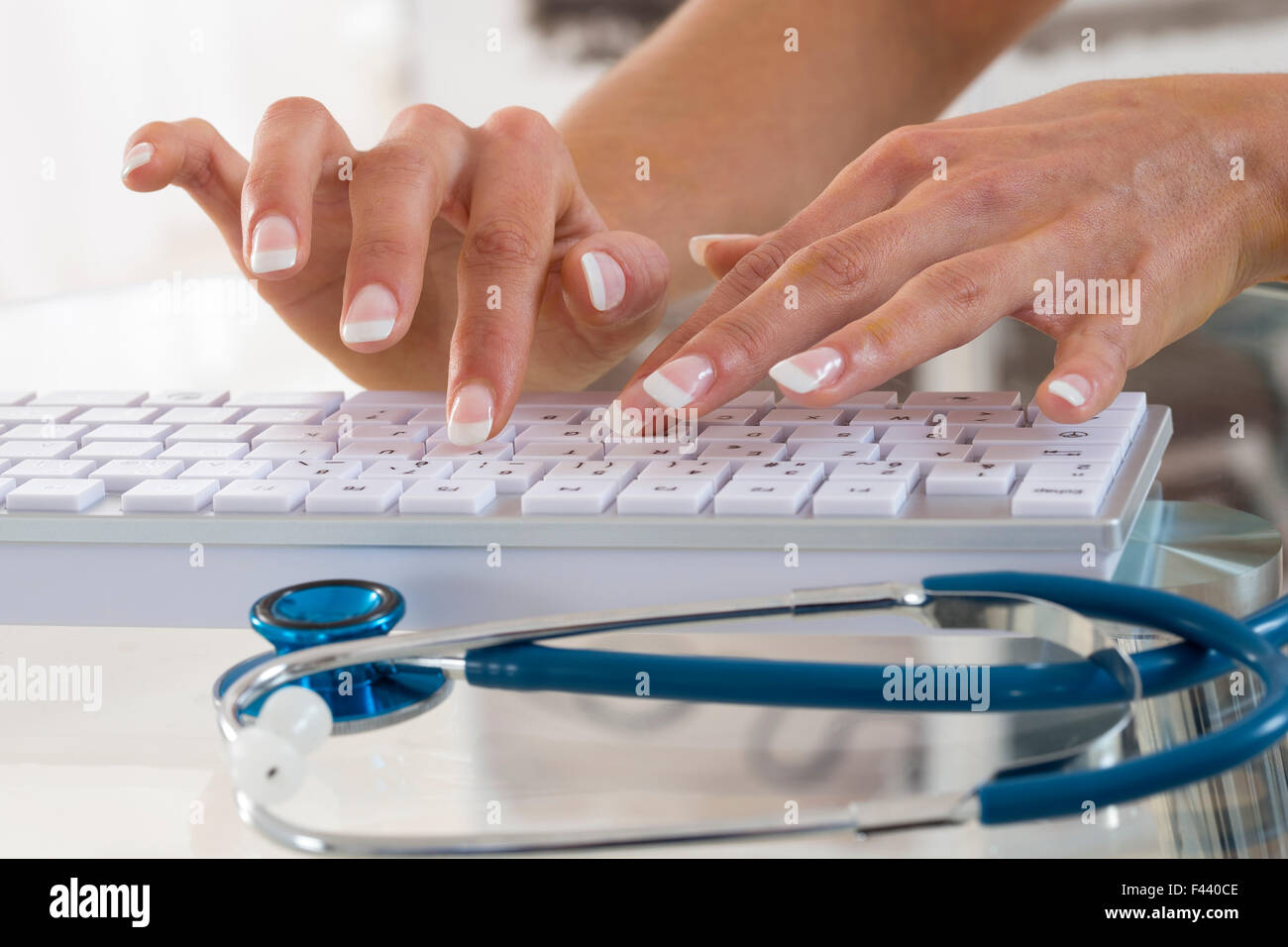 Female doctor typing computer hi-res stock photography and images - Alamy