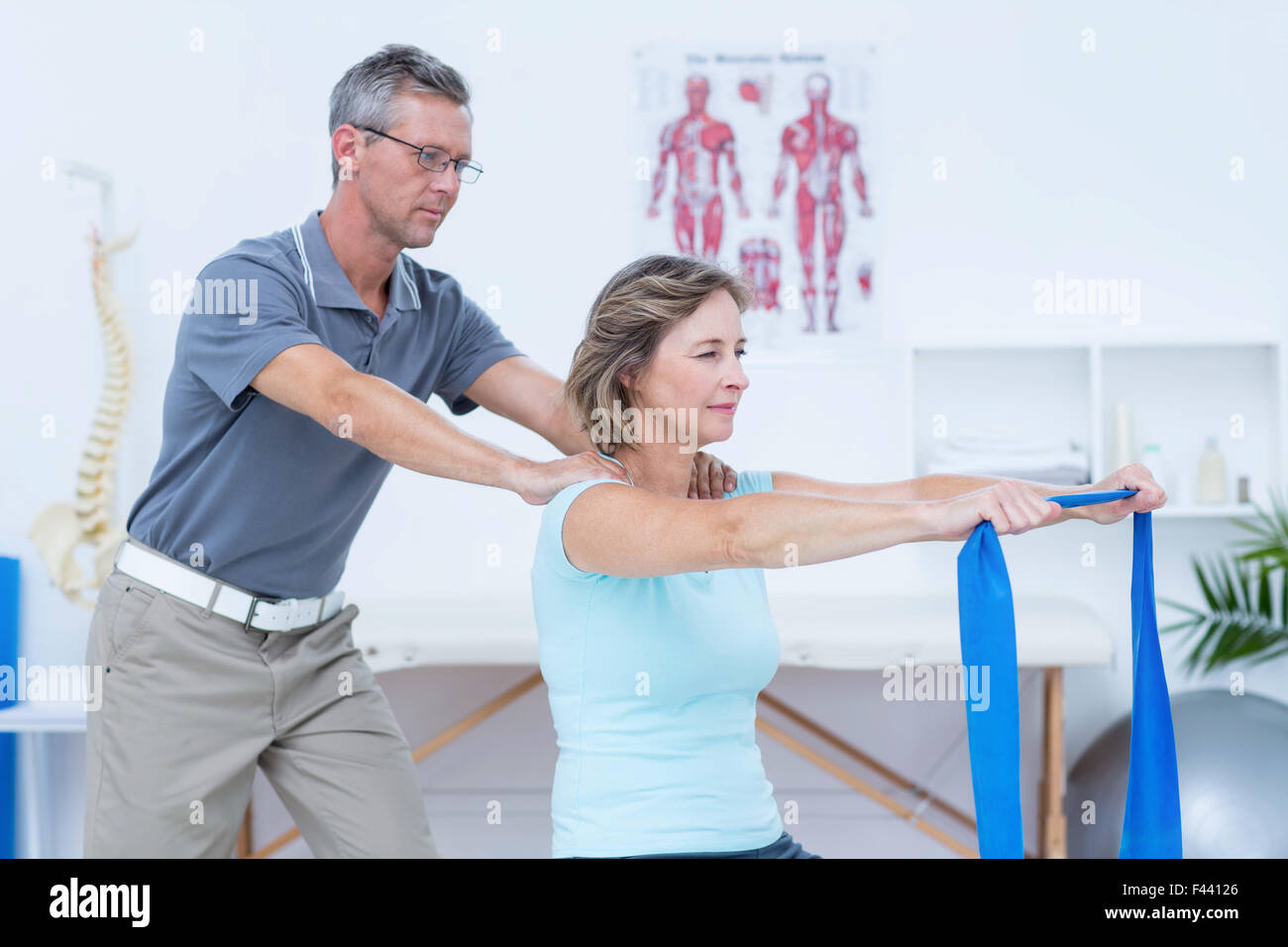 Doctor examining his patient back Stock Photo - Alamy