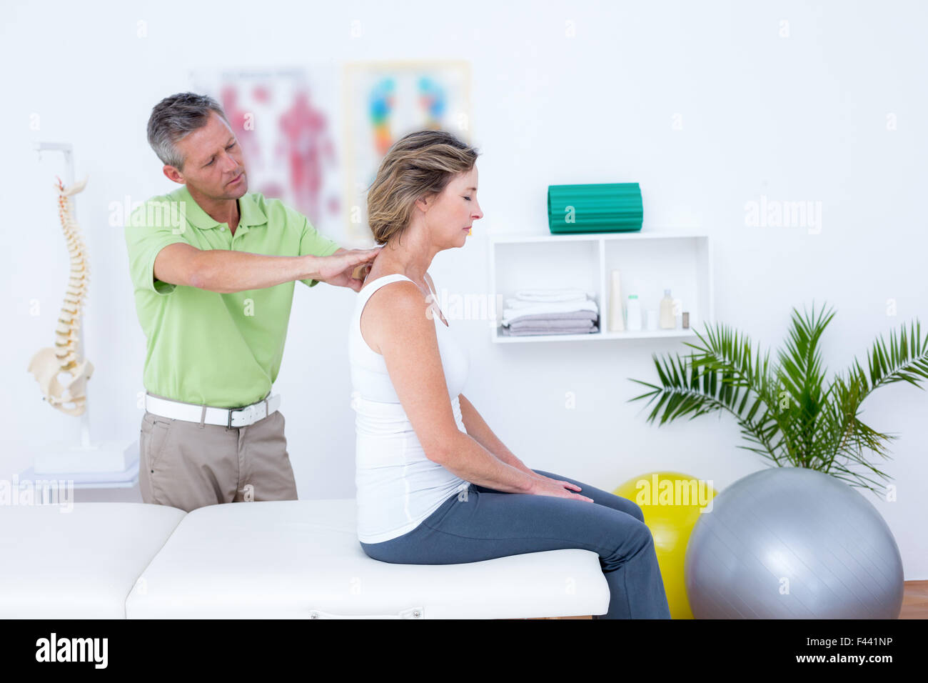 Doctor doing back adjustment Stock Photo - Alamy