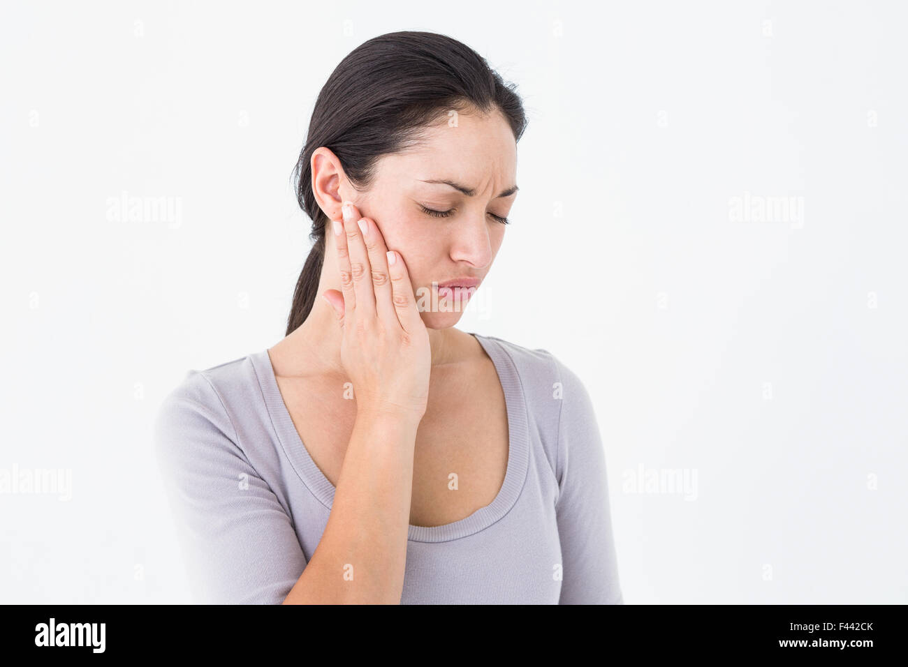 Woman suffering from teeth pain Stock Photo - Alamy