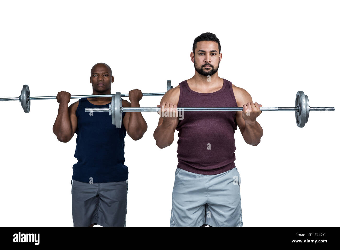 Man lifting barbell with trainer Stock Photo - Alamy