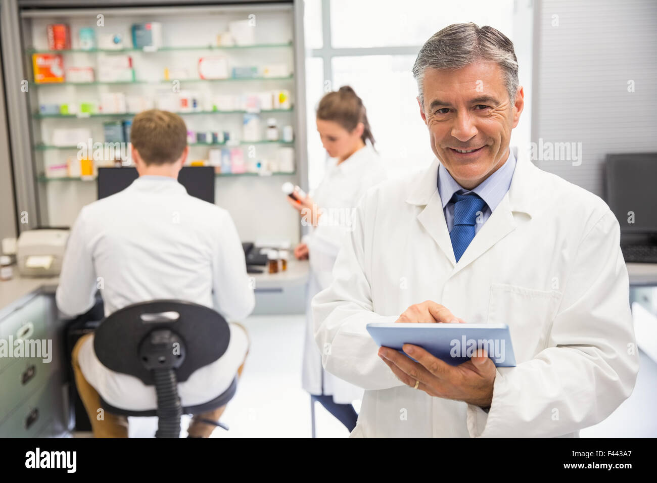 Senior woman pharmacist tablet hi-res stock photography and images - Alamy