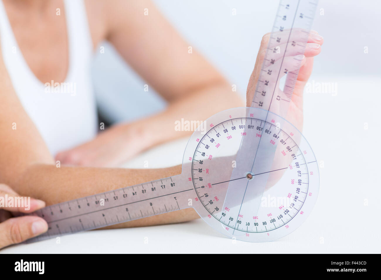 Doctor measuring wrist with goniometer Stock Photo - Alamy