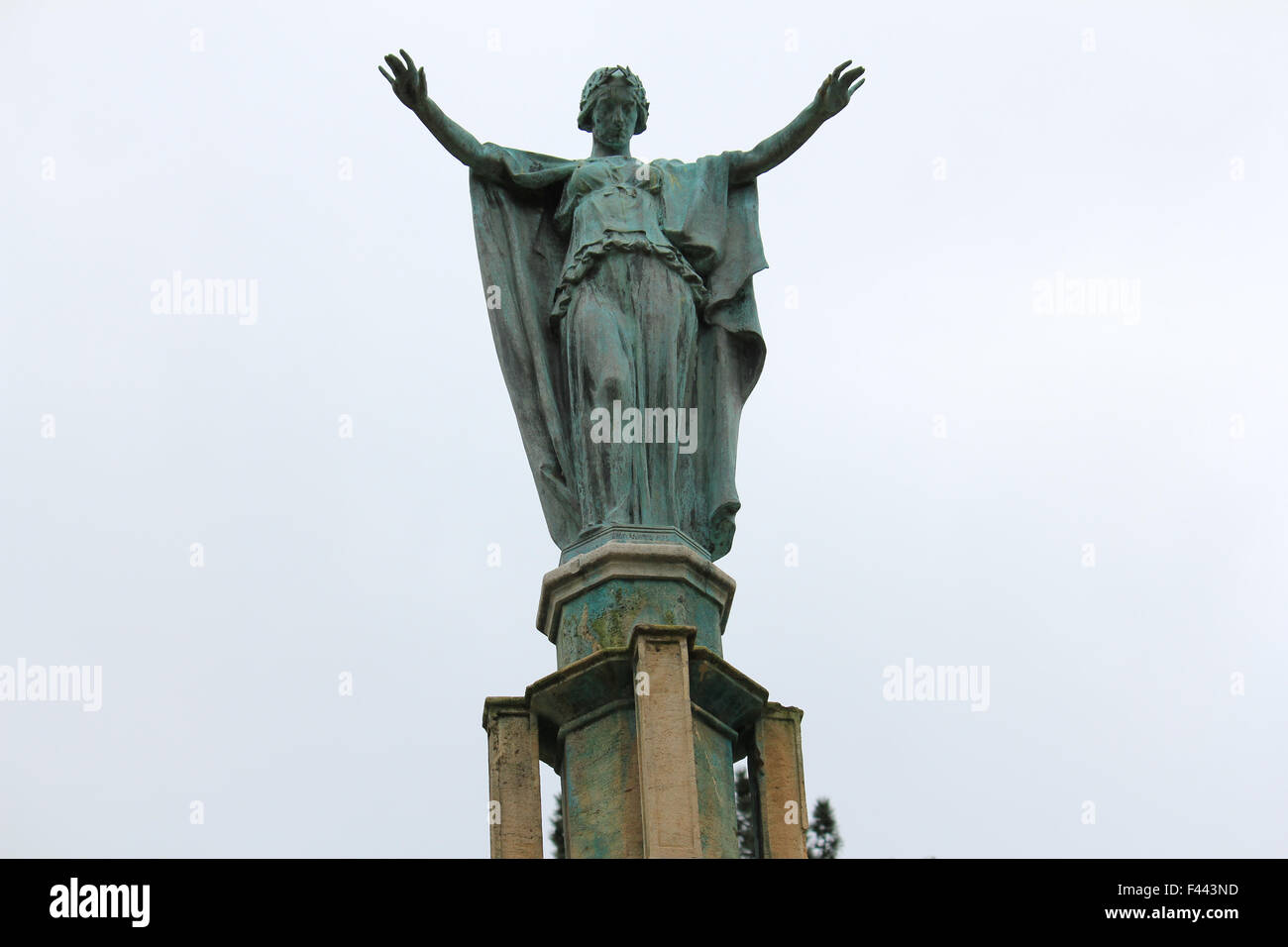 victory sculpture tops a column hands outstretched Stock Photo - Alamy