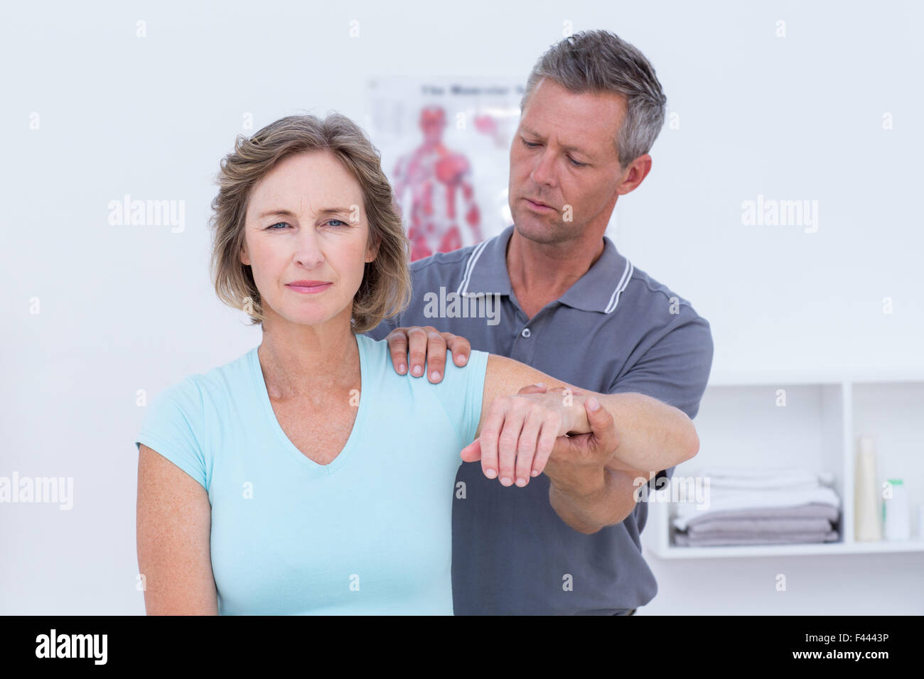 Doctor examining his patient arm Stock Photo - Alamy
