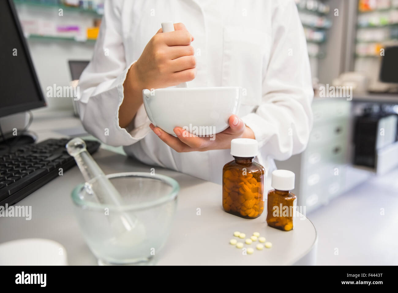 Junior pharmacist mixing a medicine Stock Photo - Alamy