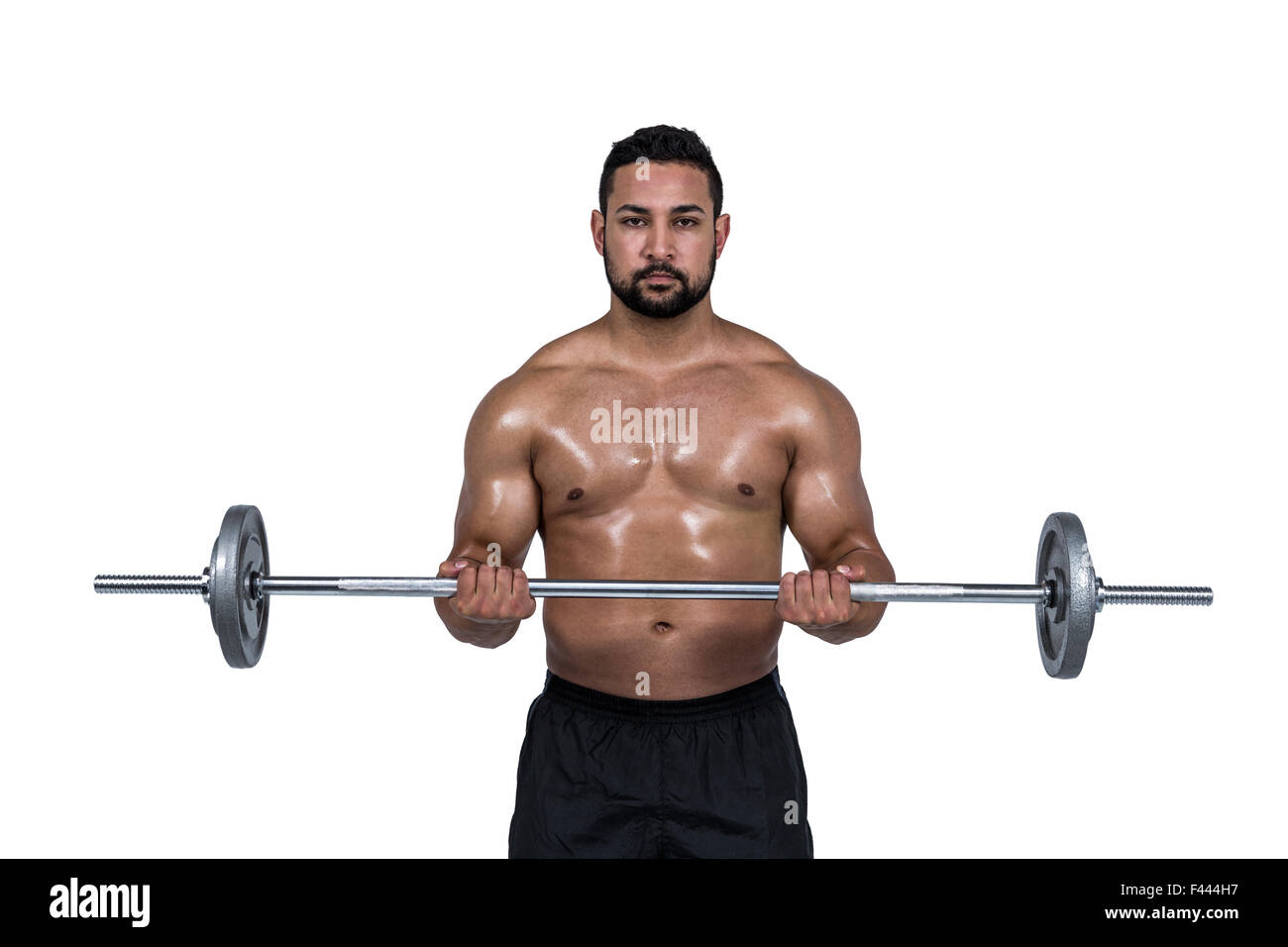 Muscular man lifting heavy barbell Stock Photo - Alamy