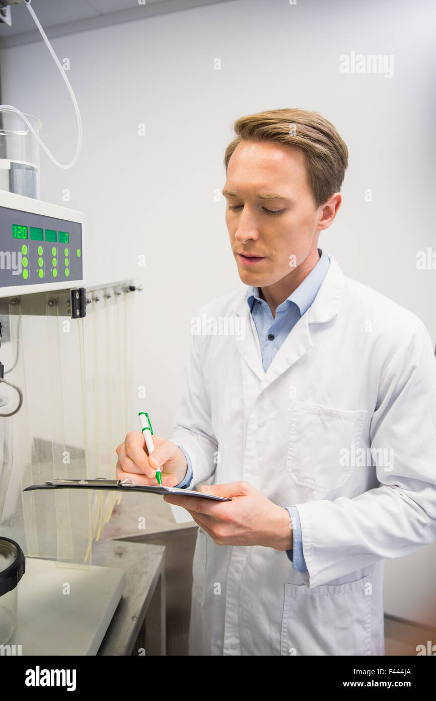 Pharmacist using machinery to make medicine Stock Photo - Alamy