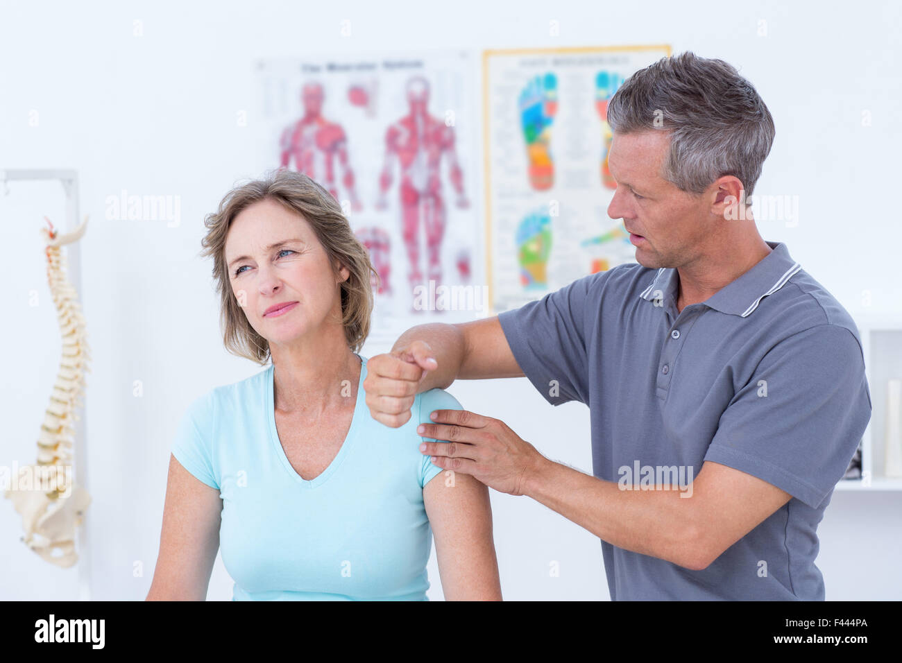 Doctor massaging his patient shoulders Stock Photo - Alamy