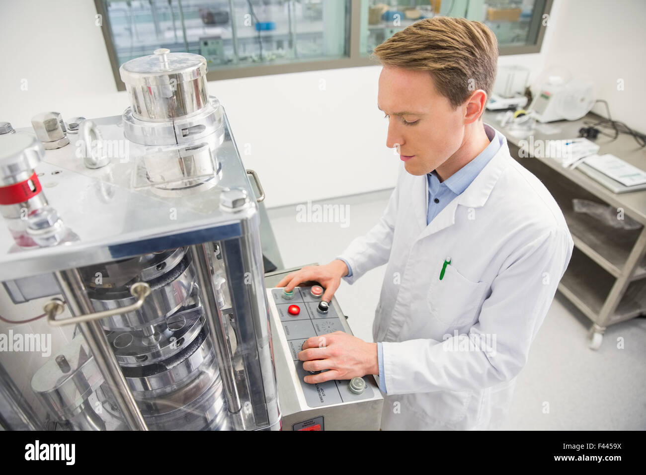 Happy pharmacist using advanced technology Stock Photo - Alamy