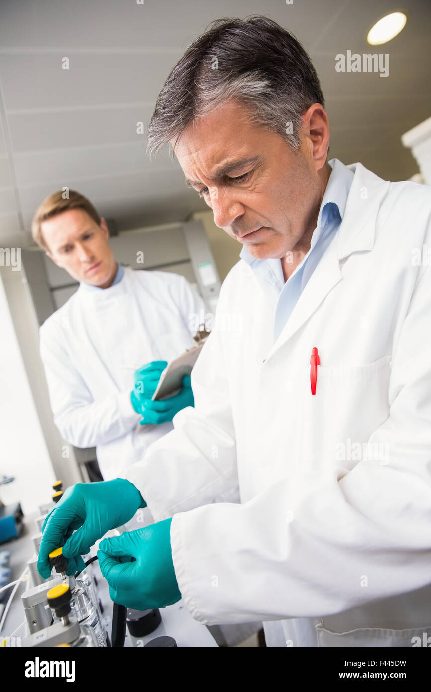 Team of scientists working together Stock Photo - Alamy