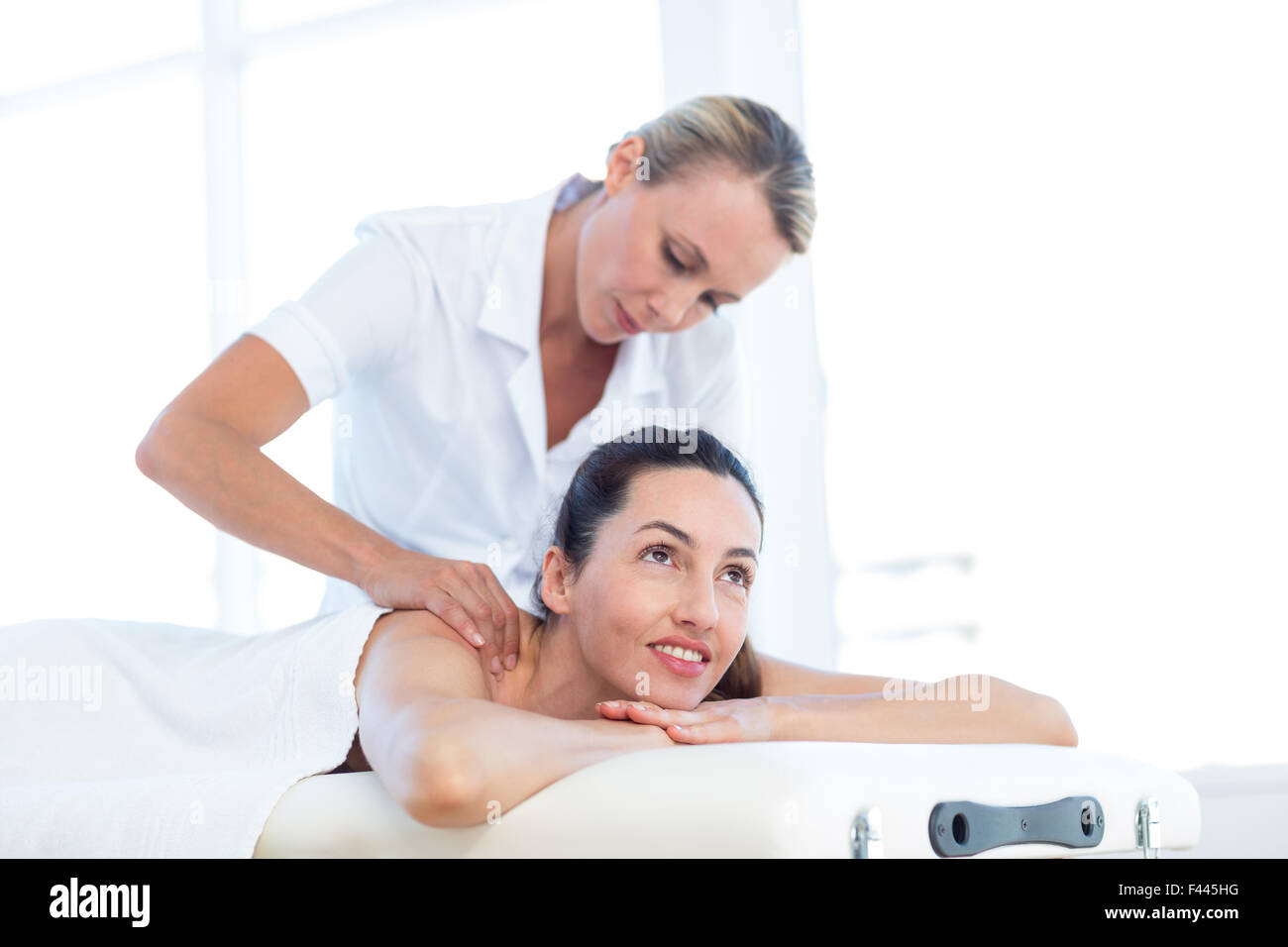 Woman having back massage Stock Photo - Alamy