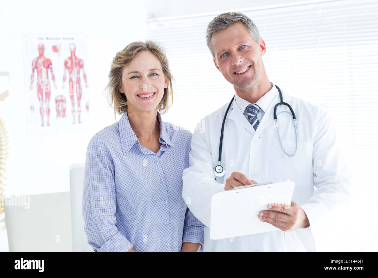 Male doctor talking camera explaining hi-res stock photography and ...