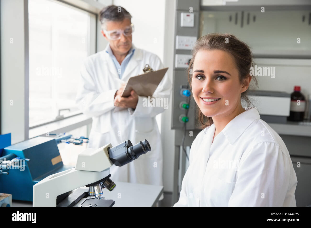 Young scientist smiling at camera Stock Photo - Alamy
