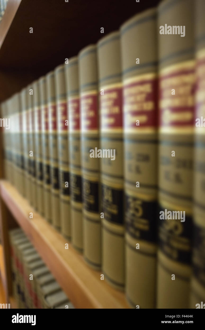 Volumes of books on bookshelf in library Stock Photo - Alamy