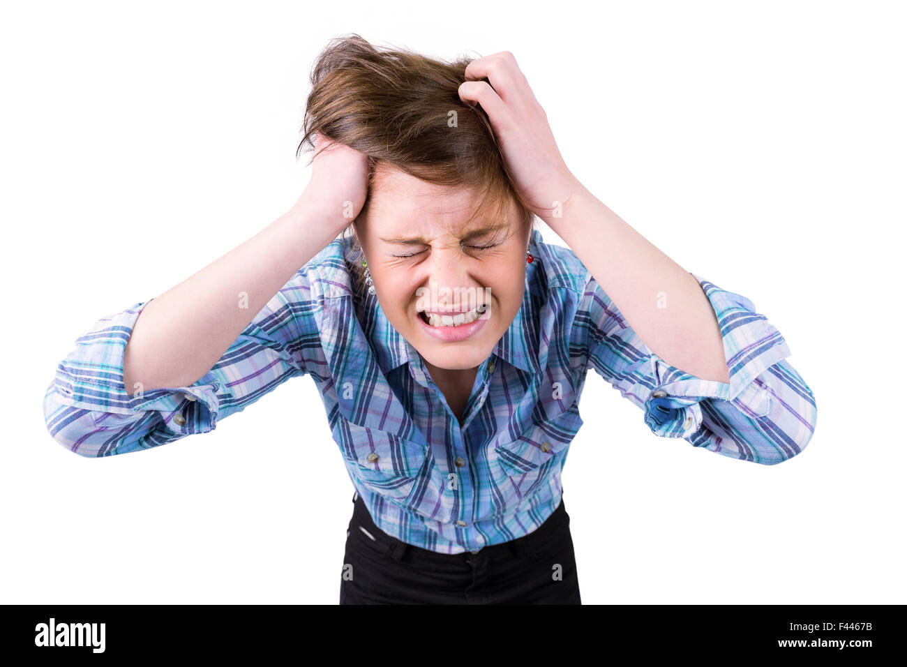 Pretty brunette shouting with hands on head Stock Photo - Alamy