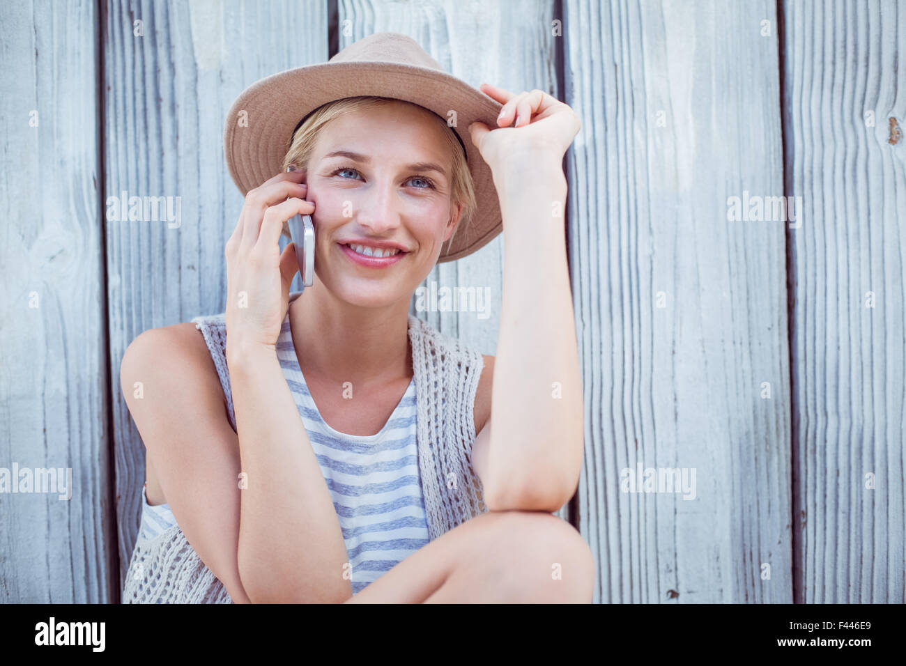 Pretty blonde woman calling on the phone Stock Photo - Alamy