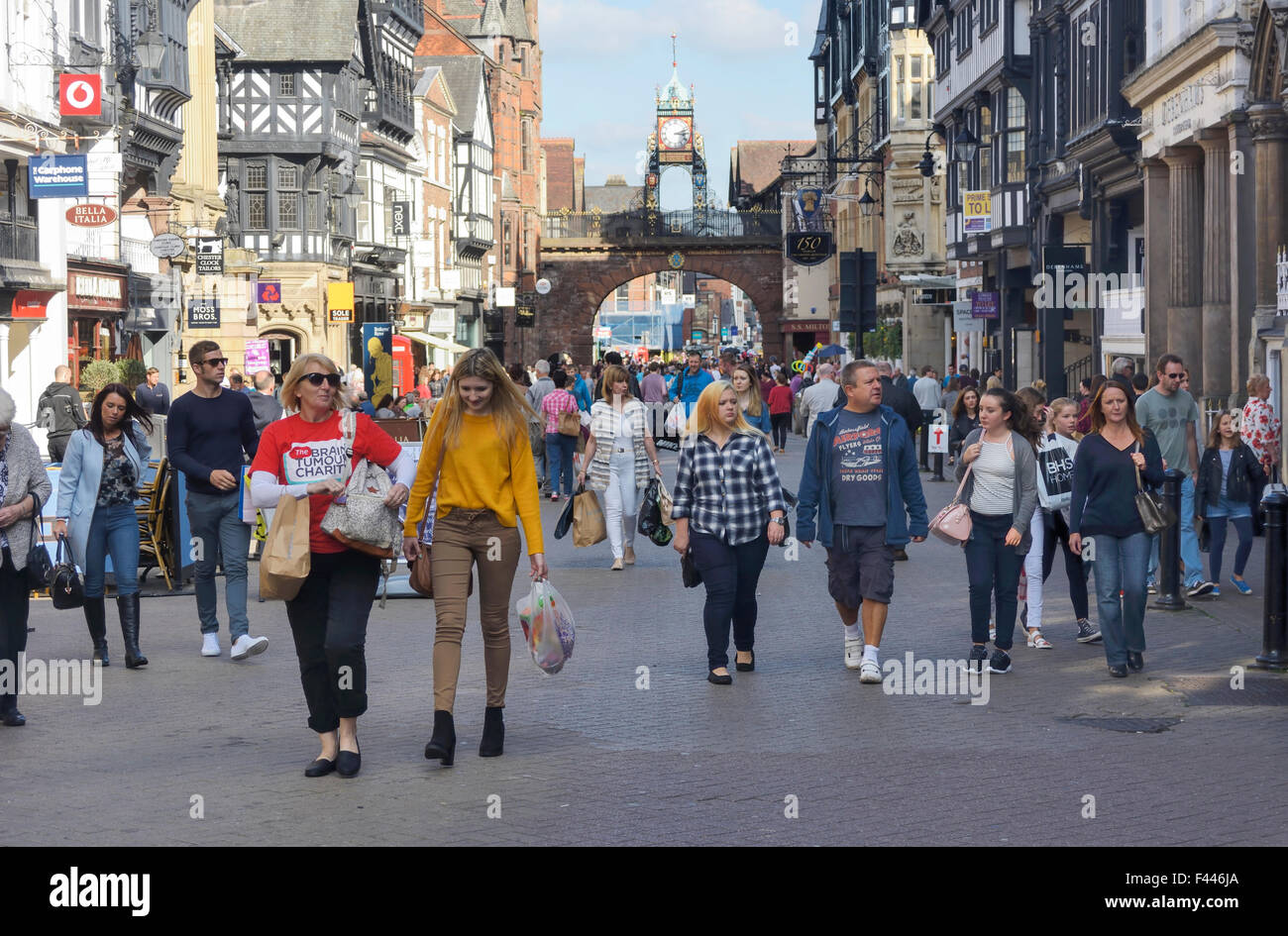 Shoppers and tourist in the busy Eastgate Street, Chester Stock Photo ...