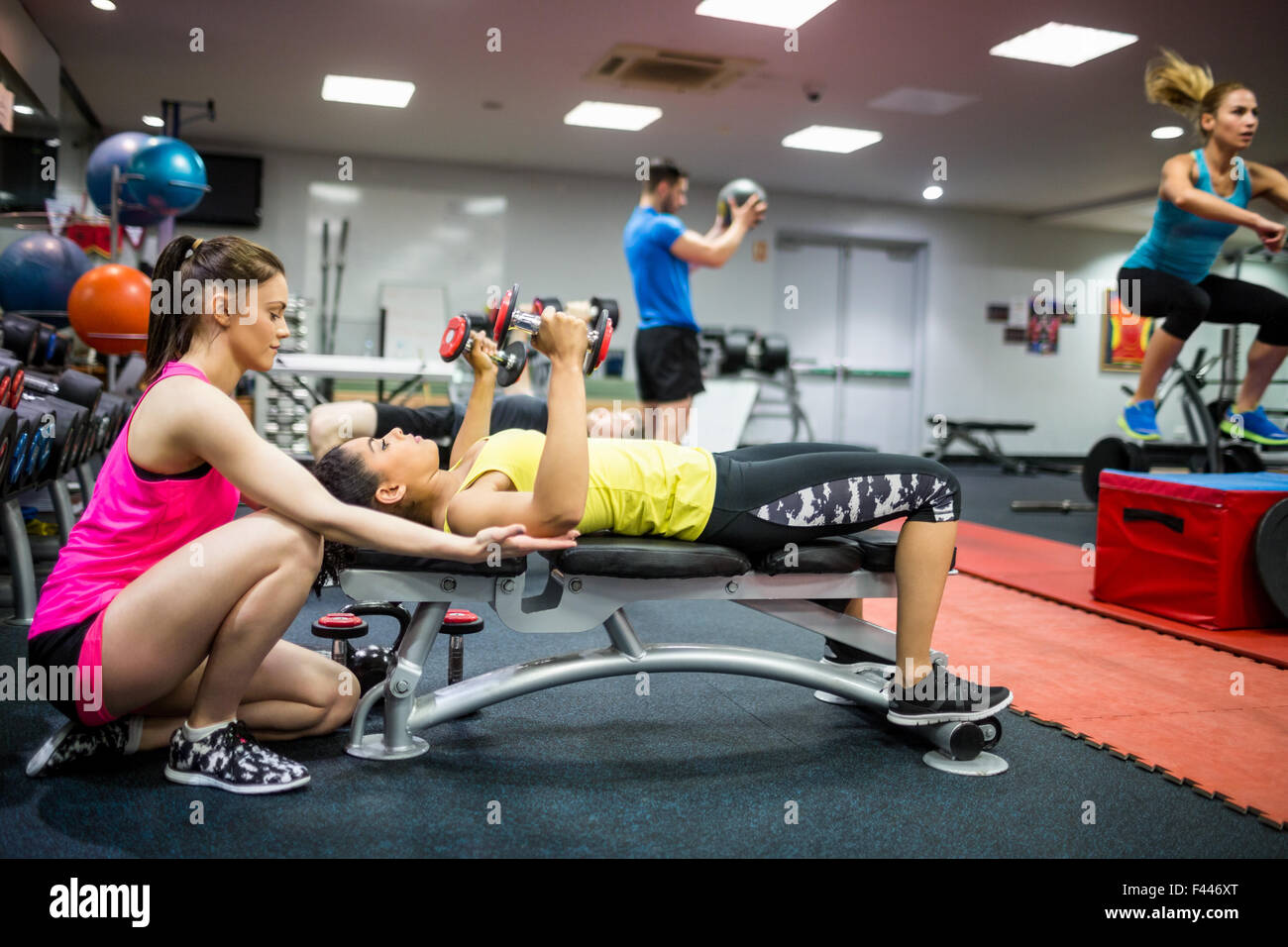 Fit people working out in weights room Stock Photo - Alamy