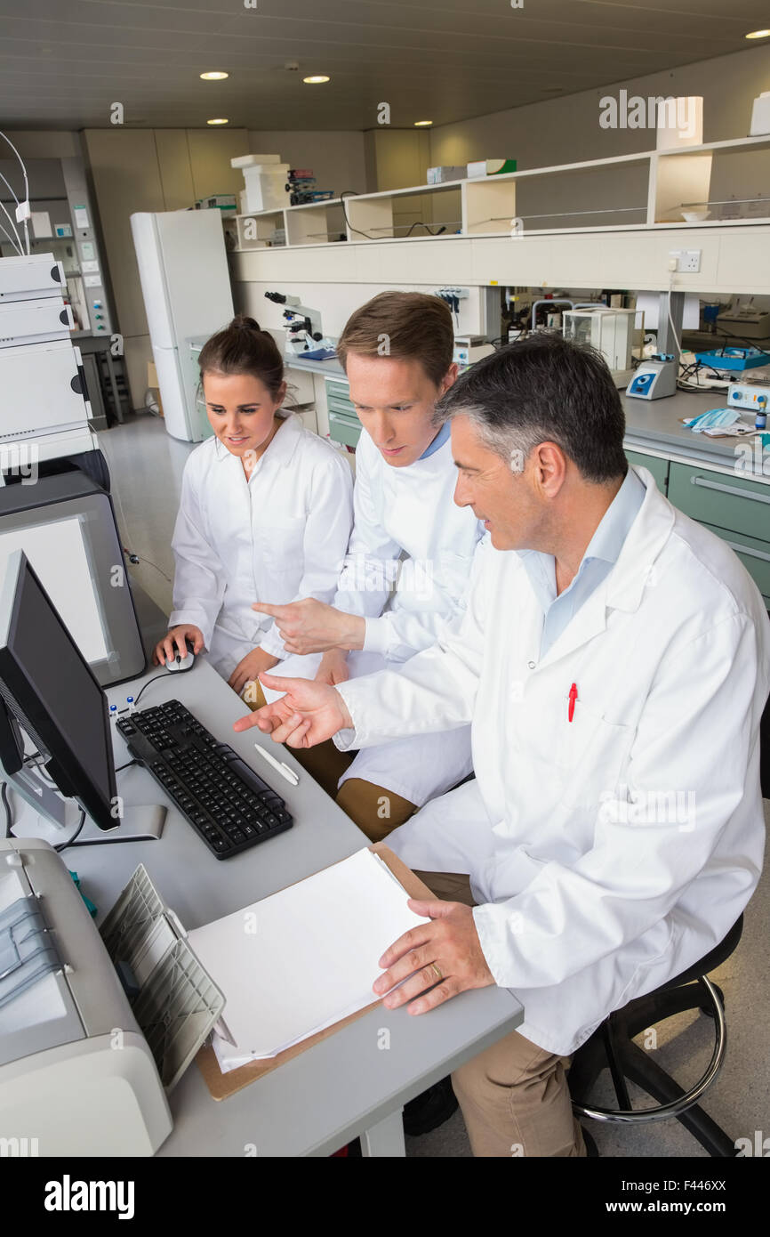 Team of scientists working together Stock Photo - Alamy