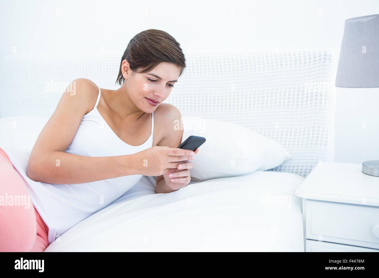 Pretty woman using her phone Stock Photo - Alamy