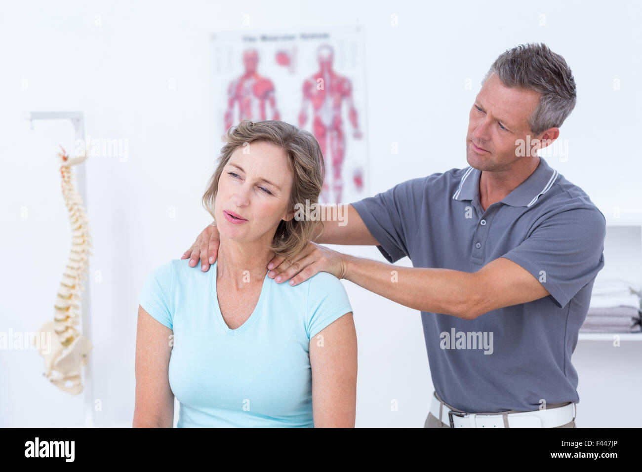 Doctor massage back shoulders hi-res stock photography and images - Alamy