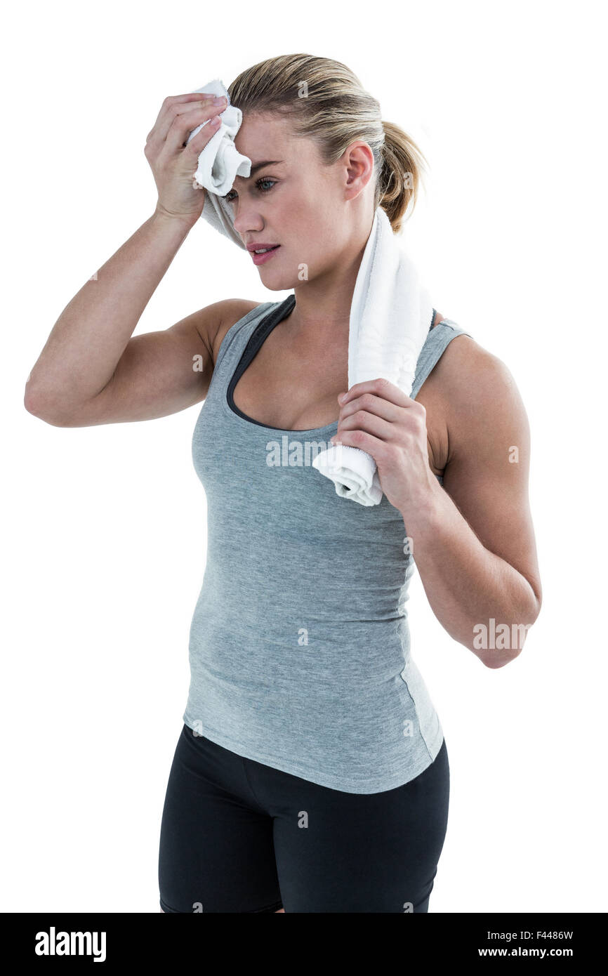 Muscular woman wiping herself with towel Stock Photo - Alamy