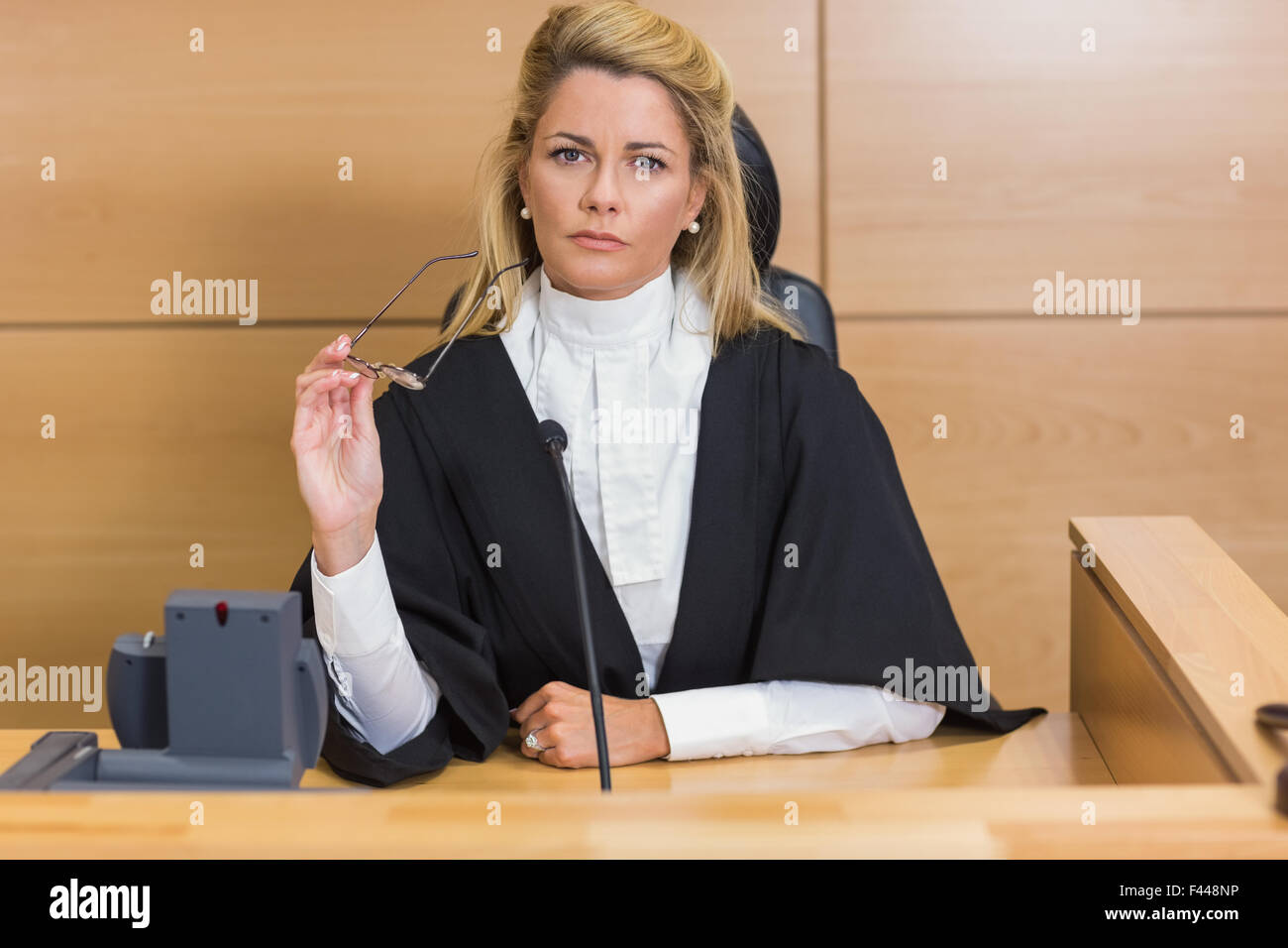 Stern judge looking at camera Stock Photo - Alamy