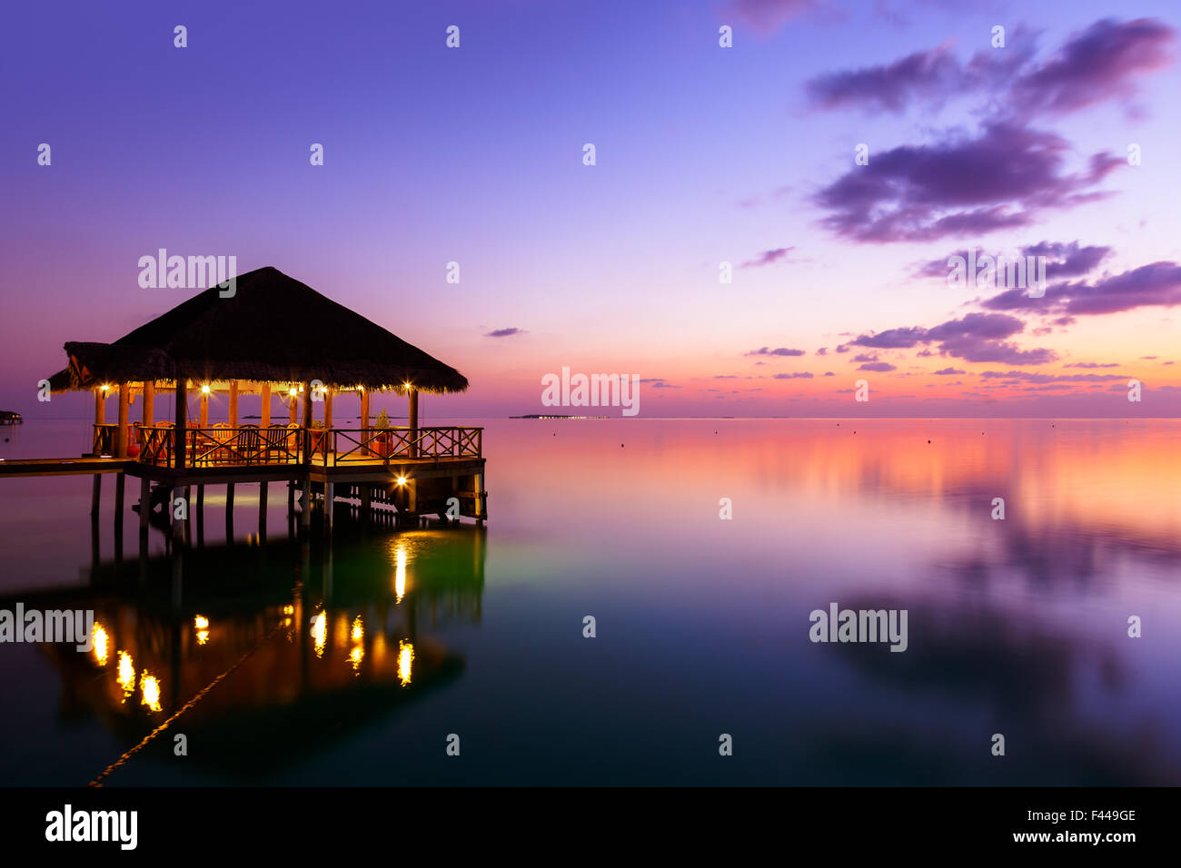 Water cafe at sunset - Maldives Stock Photo - Alamy