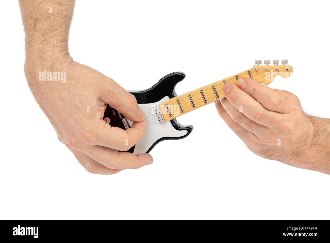 Hands and toy electric guitar Stock Photo - Alamy