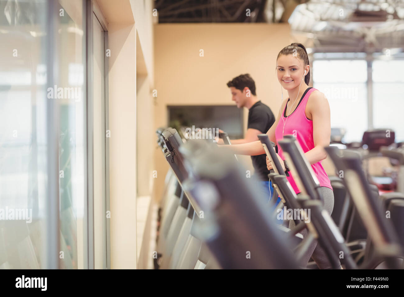 Fit people working out using machines Stock Photo - Alamy