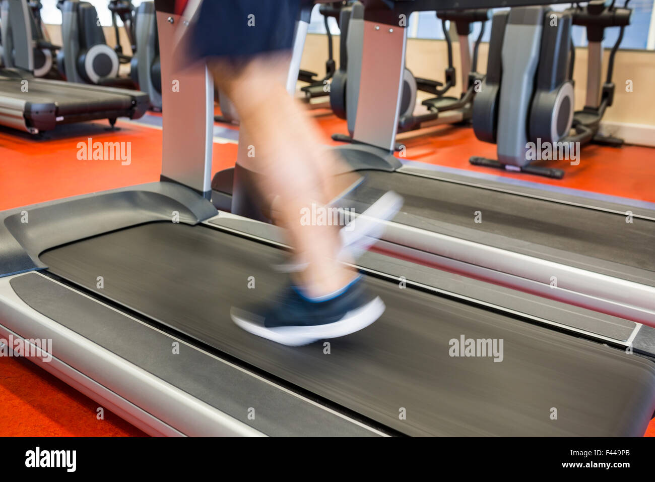 Man running on a treadmill Stock Photo - Alamy