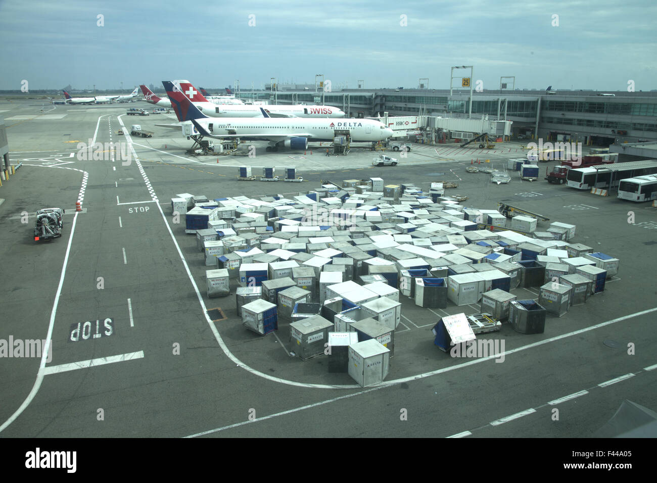 Mass of cargo containers that transport luggage and other cargo to and ...
