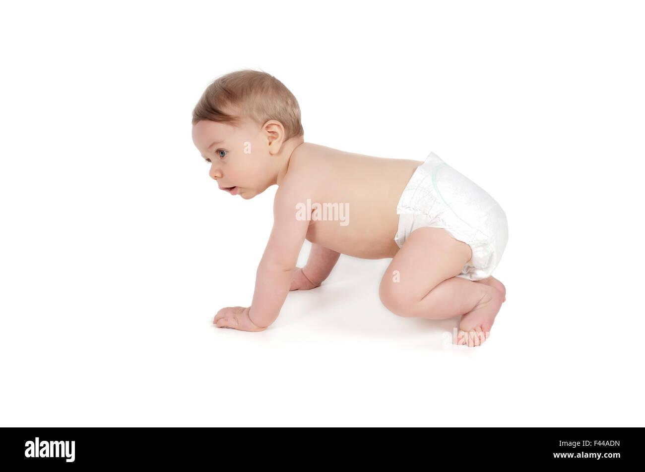 Side view of pretty crawling baby Stock Photo - Alamy