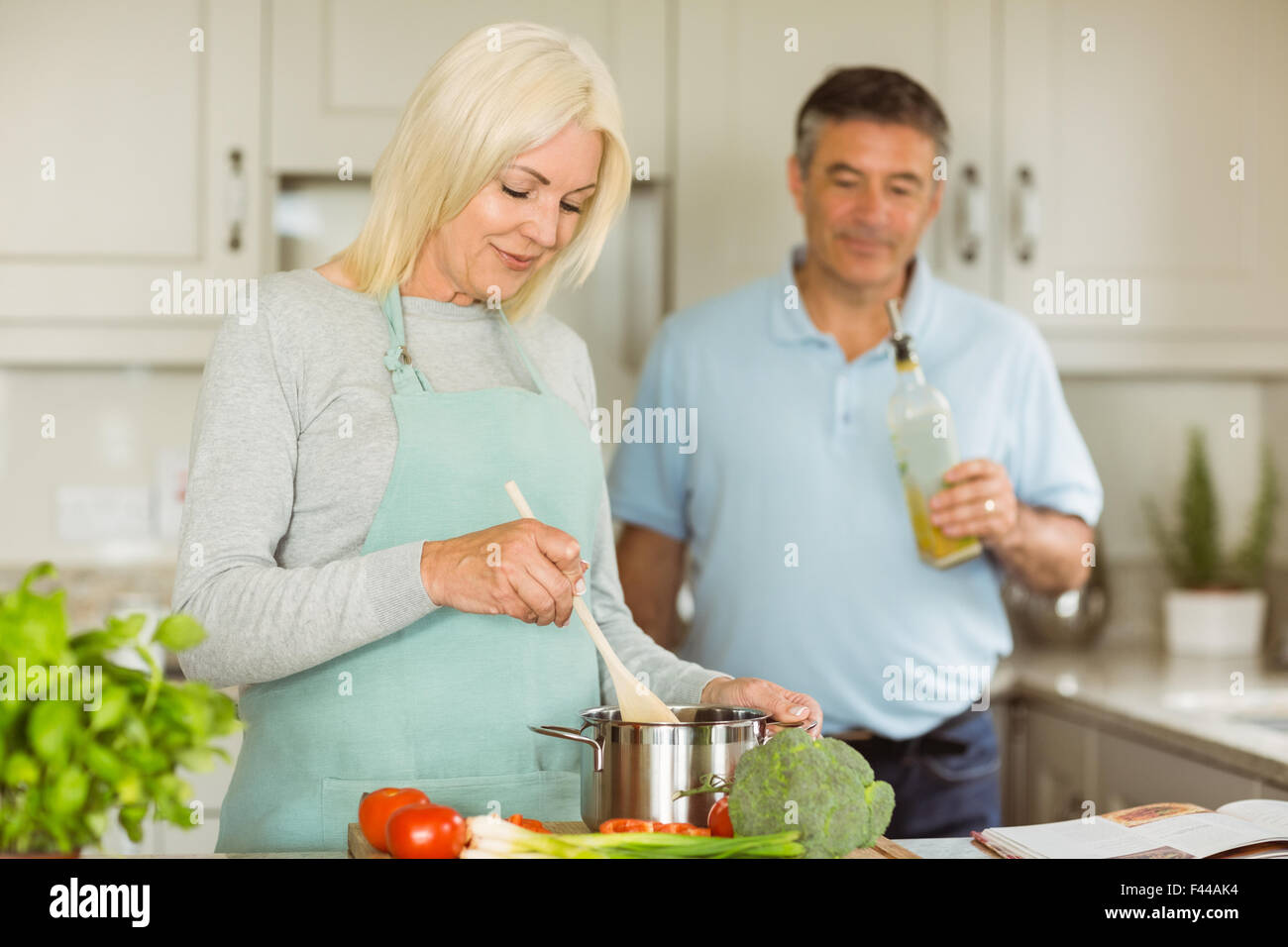 Mature couple making dinner together Stock Photo - Alamy