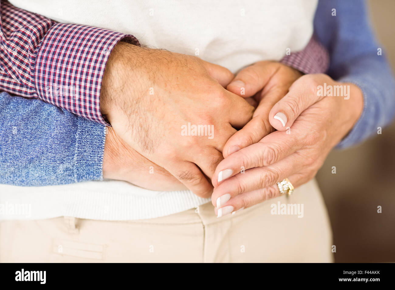 Happy mature couple hugging each other Stock Photo - Alamy