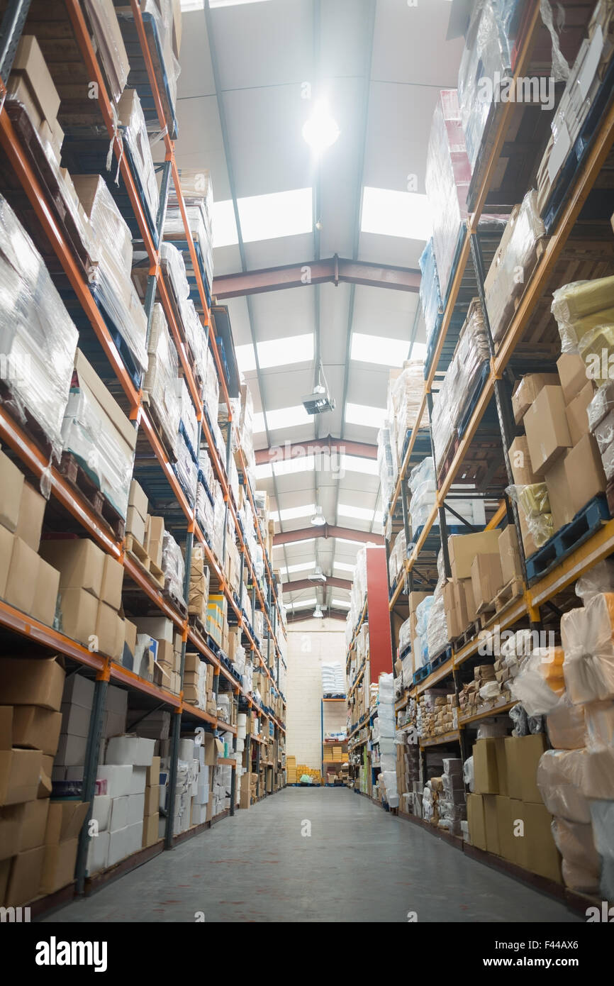 Shelves with boxes in warehouse Stock Photo - Alamy