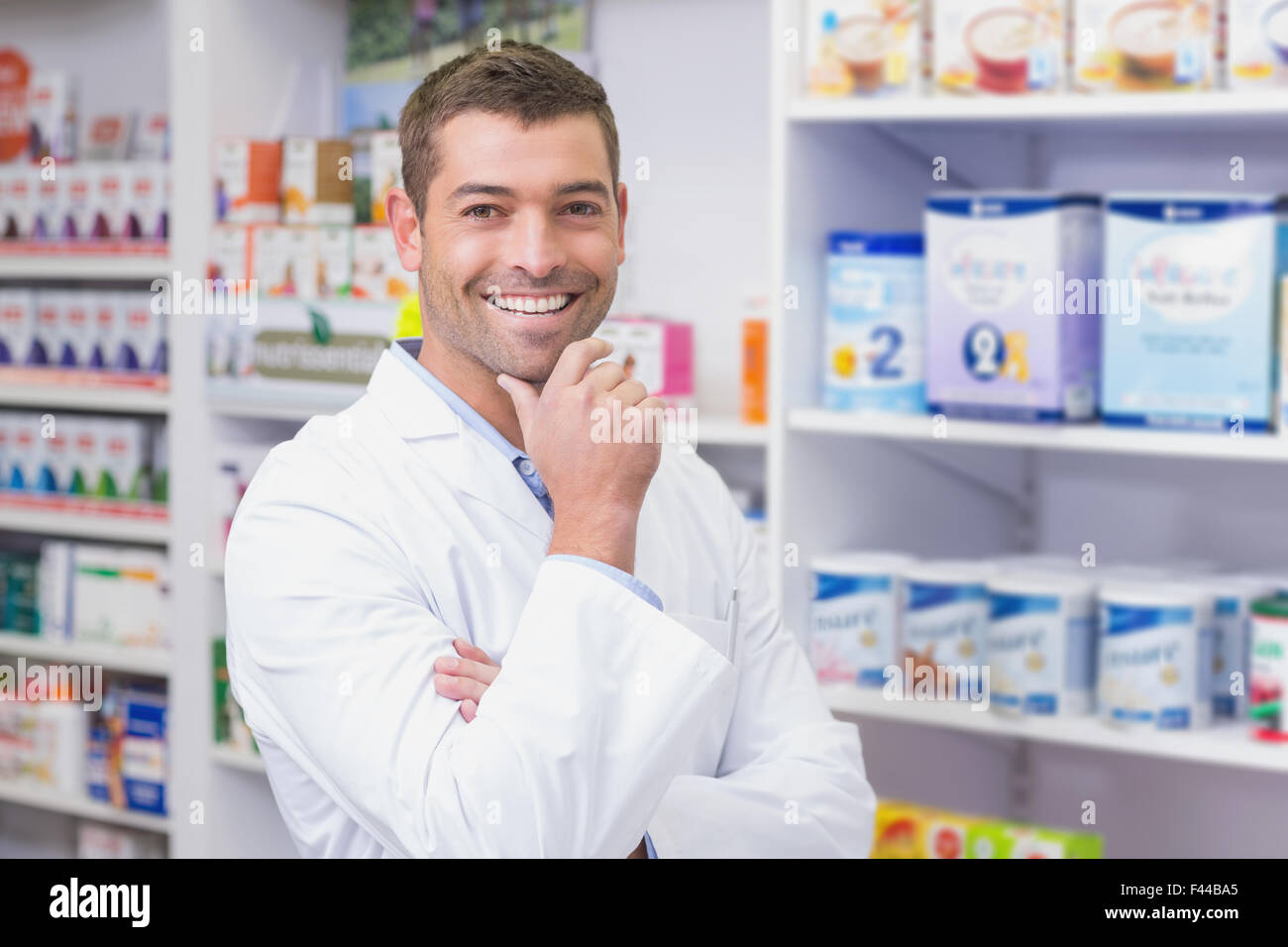 Handsome pharmacist smiling at camera Stock Photo - Alamy