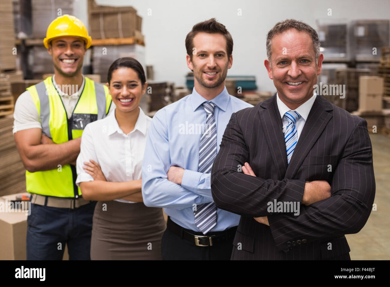 Portrait warehouse team standing arms hi-res stock photography and images - Alamy