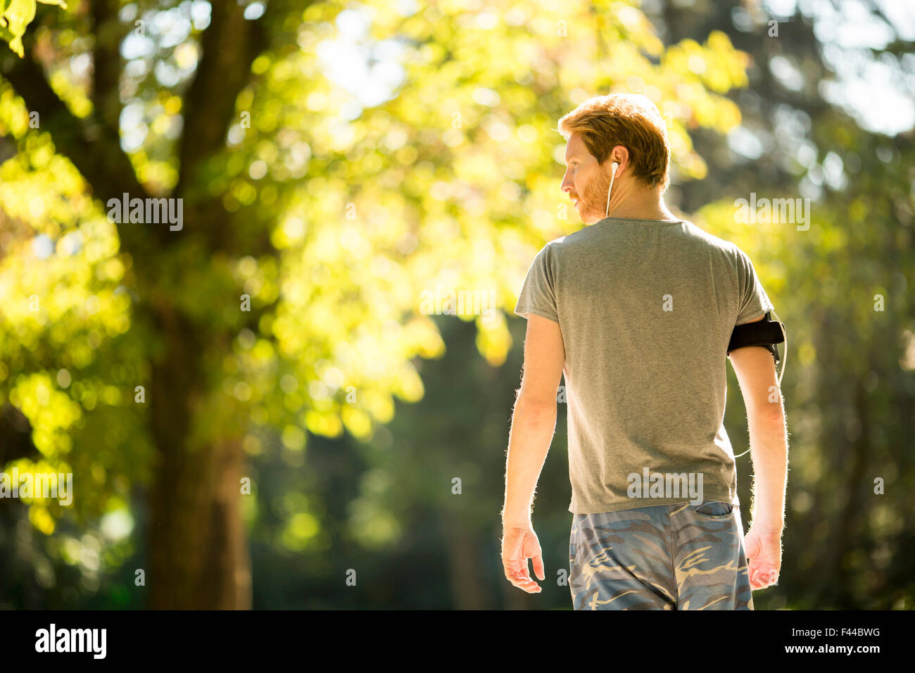 Young man resting outdoors Stock Photo - Alamy